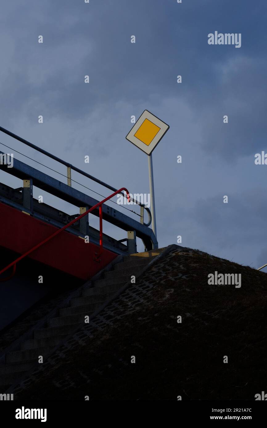 A pole with the main road sign isolated against the backdrop of a ...