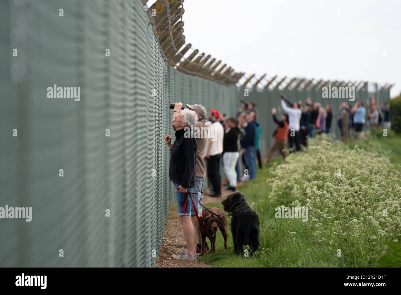 People watch from the perimeter fence as the UK's only airworthy ...