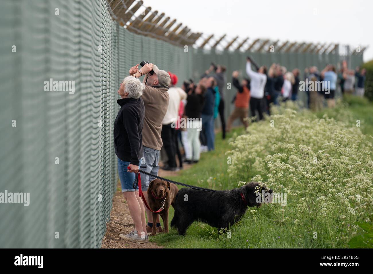 People watch from the perimeter fence as the UK's only airworthy ...