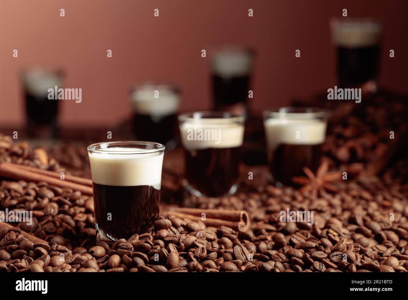 White Russian cocktail. Vodka, coffee liqueur, and cream. Coffee beans ...