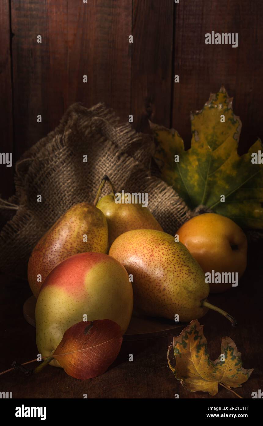 Ripe pears on a dark wooden background in a rustic style Stock Photo ...