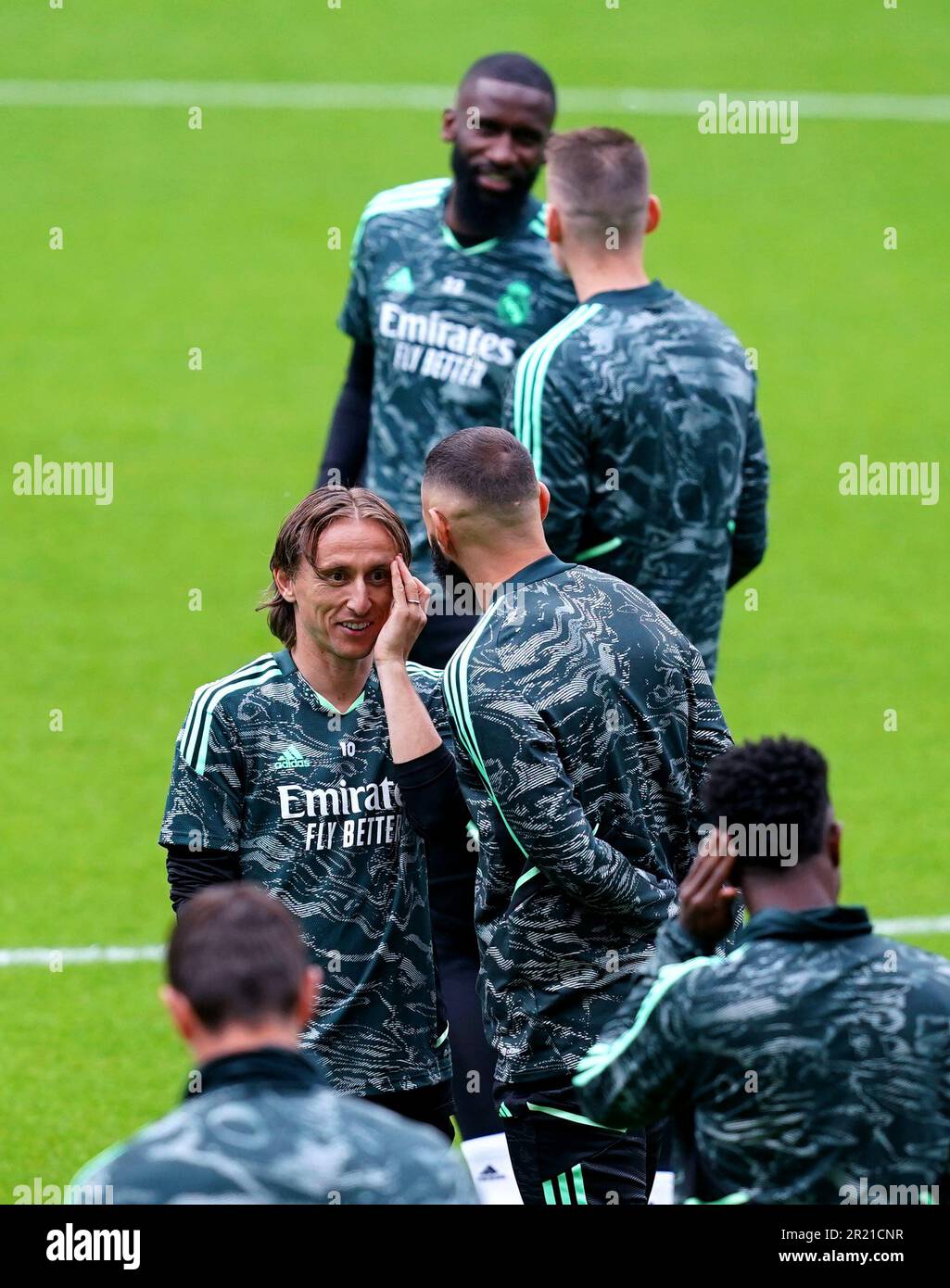 Real Madrid's Luka Modric speaks to Karim Benzema during a training ...