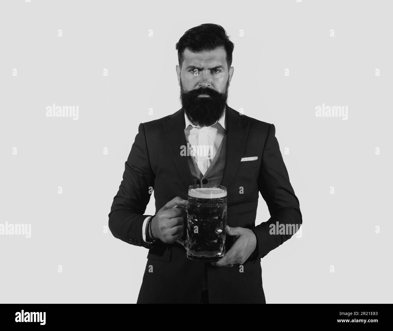 Retro man in classic suit drinking beer. Bearded guy in business outfit ...