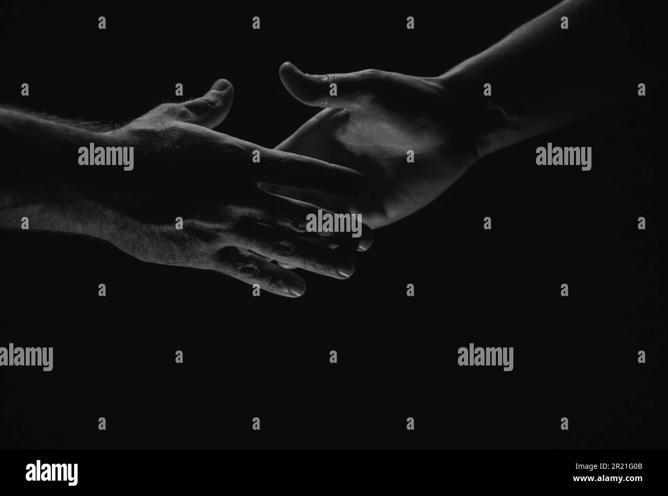 Handshake. Men holding hands isolated on black. Connection and human ...