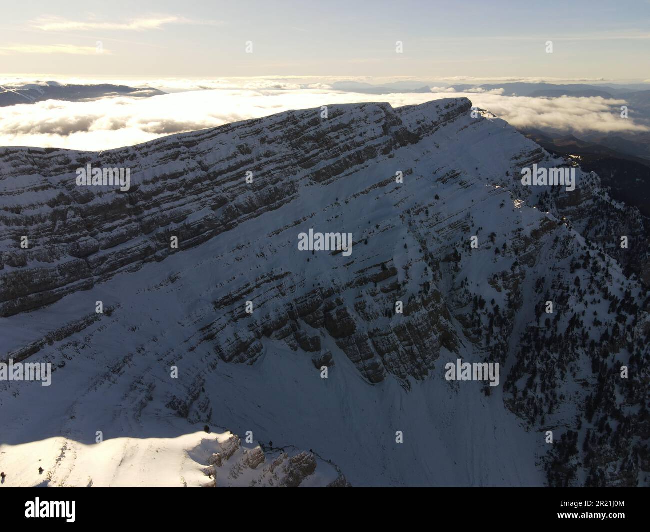 A majestic landscape of a snowy mountain range in the Spanish Pyrenees ...