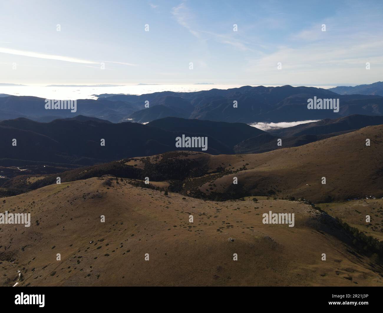 A majestic mountain range in the Spanish Pyrenees is displayed with a ...