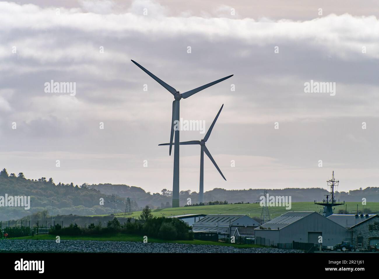 Wind power generators in the south of Ireland, landscape. Two wind ...