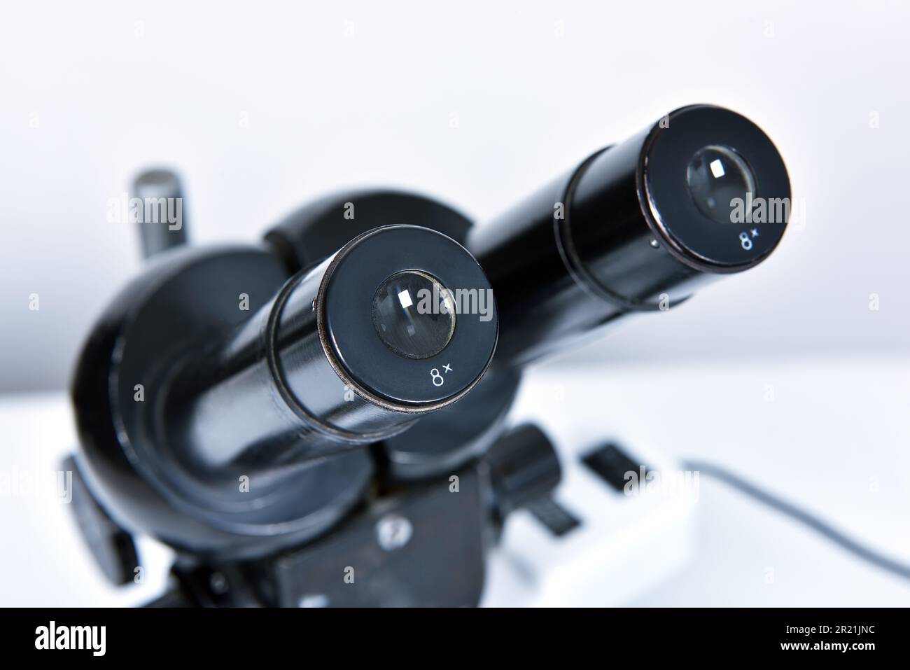 old microscope on a white background Stock Photo - Alamy