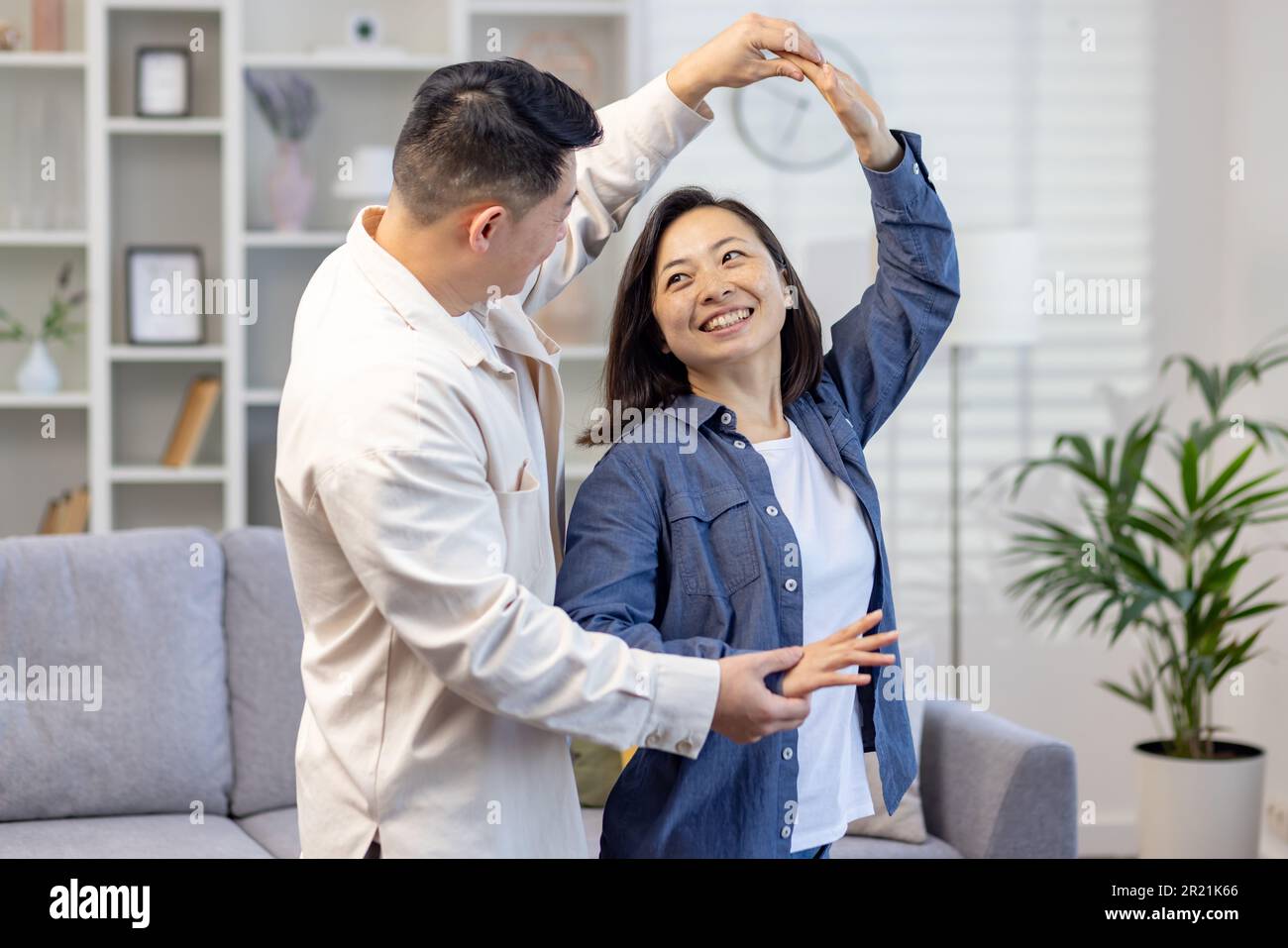 Happy Asian couple, young family man and woman celebrate moving to a ...