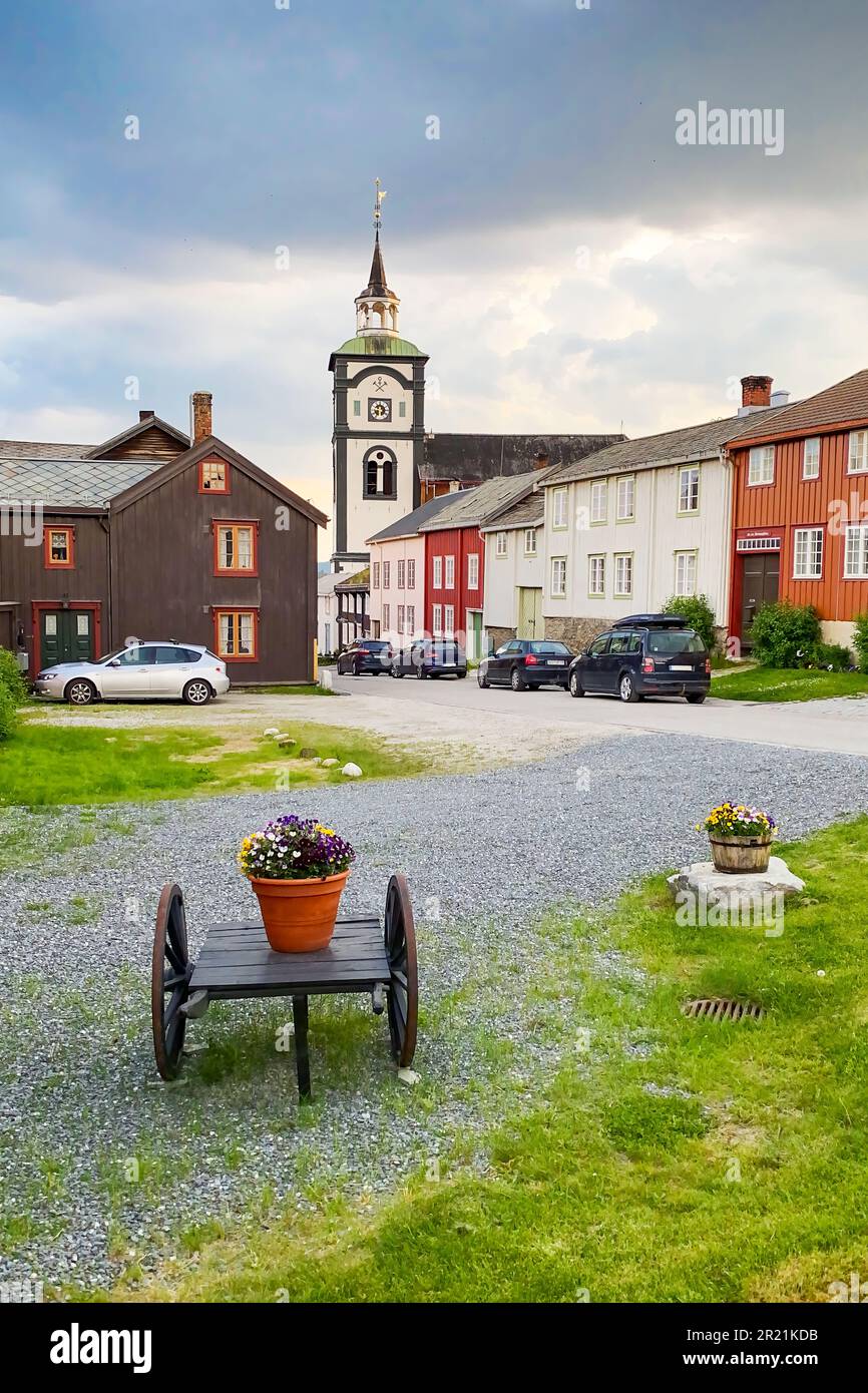 Historic wooden houses and church tower, Roros copper mining town ...