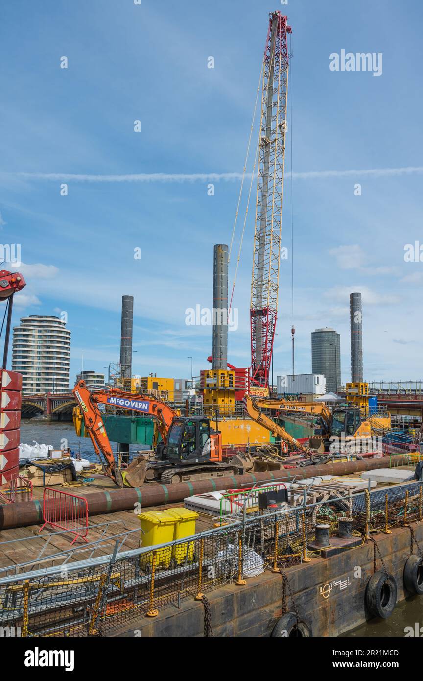 Heavy construction machinery on a barge on the River Thames at Vauxhall ...