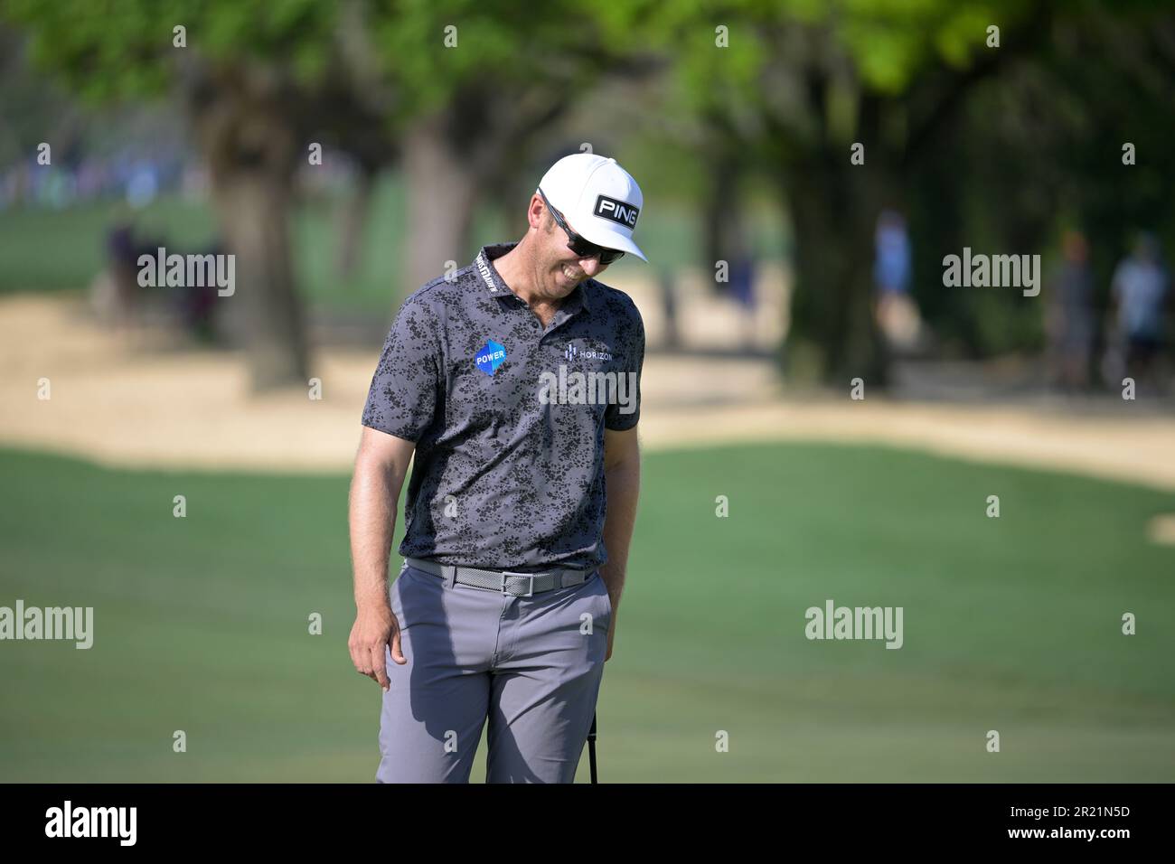 Seamus Power, of Ireland, reacts to his putt on the ninth green during ...