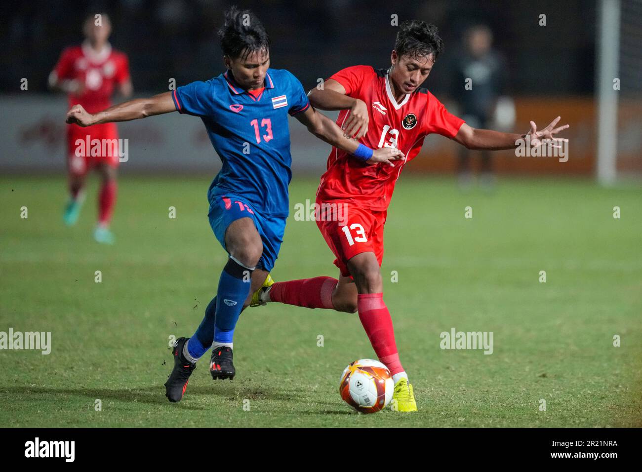 Indonesia's Muhammad Haykal, right, battles for the ball against Thailand's Phongsakon Trisat ...