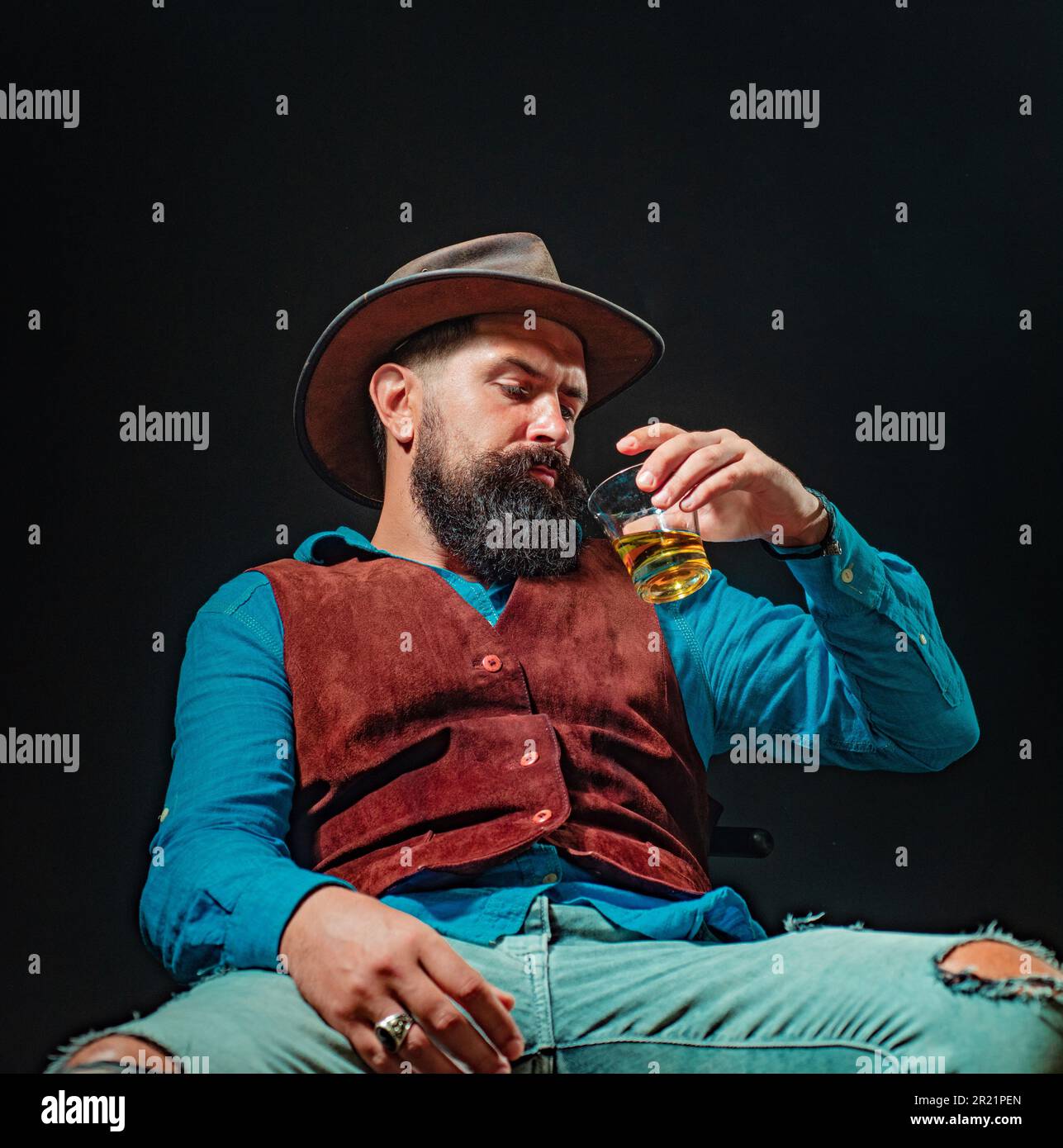 Man with beard holds glass brandy. Bad habit - alcohol addiction ...