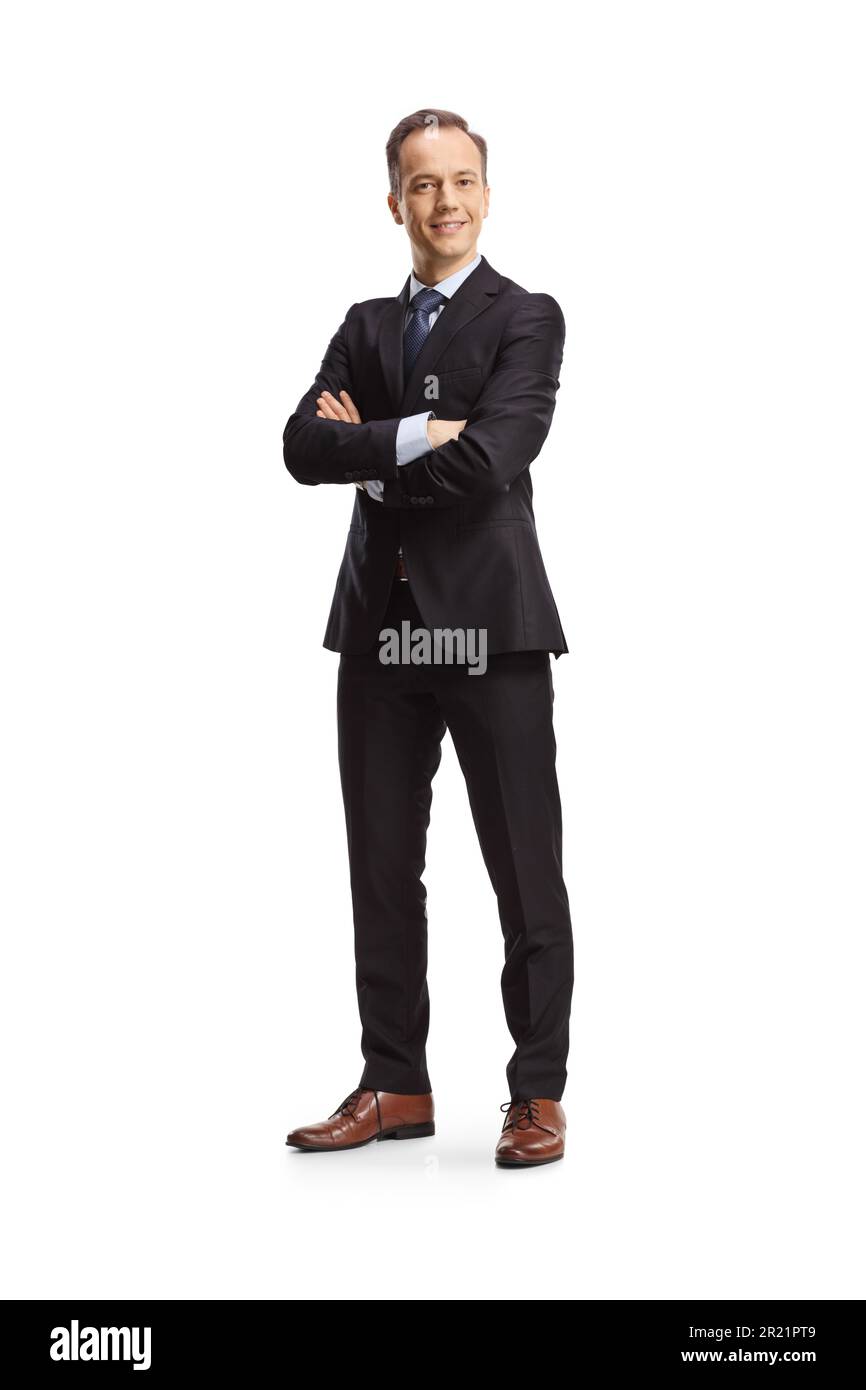 Full length portrait of a businessman posing with folded arms and ...