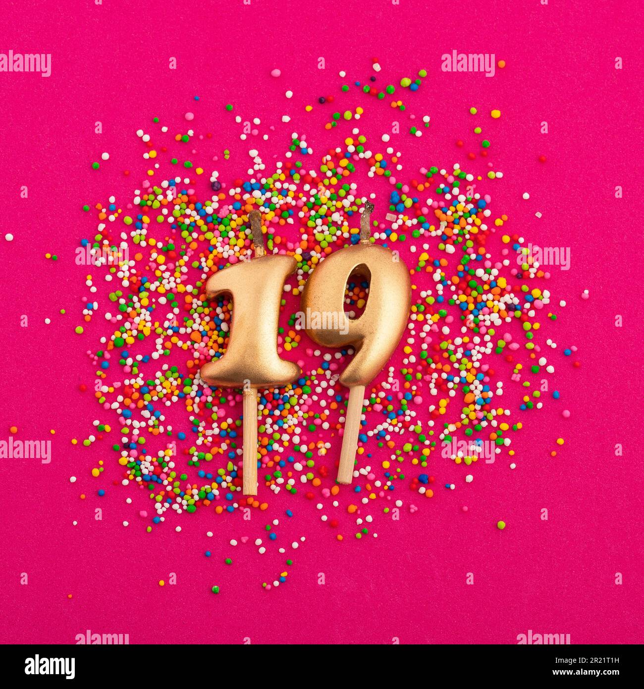 Candle number 19 - Birthday or anniversary on rhodamine red background ...