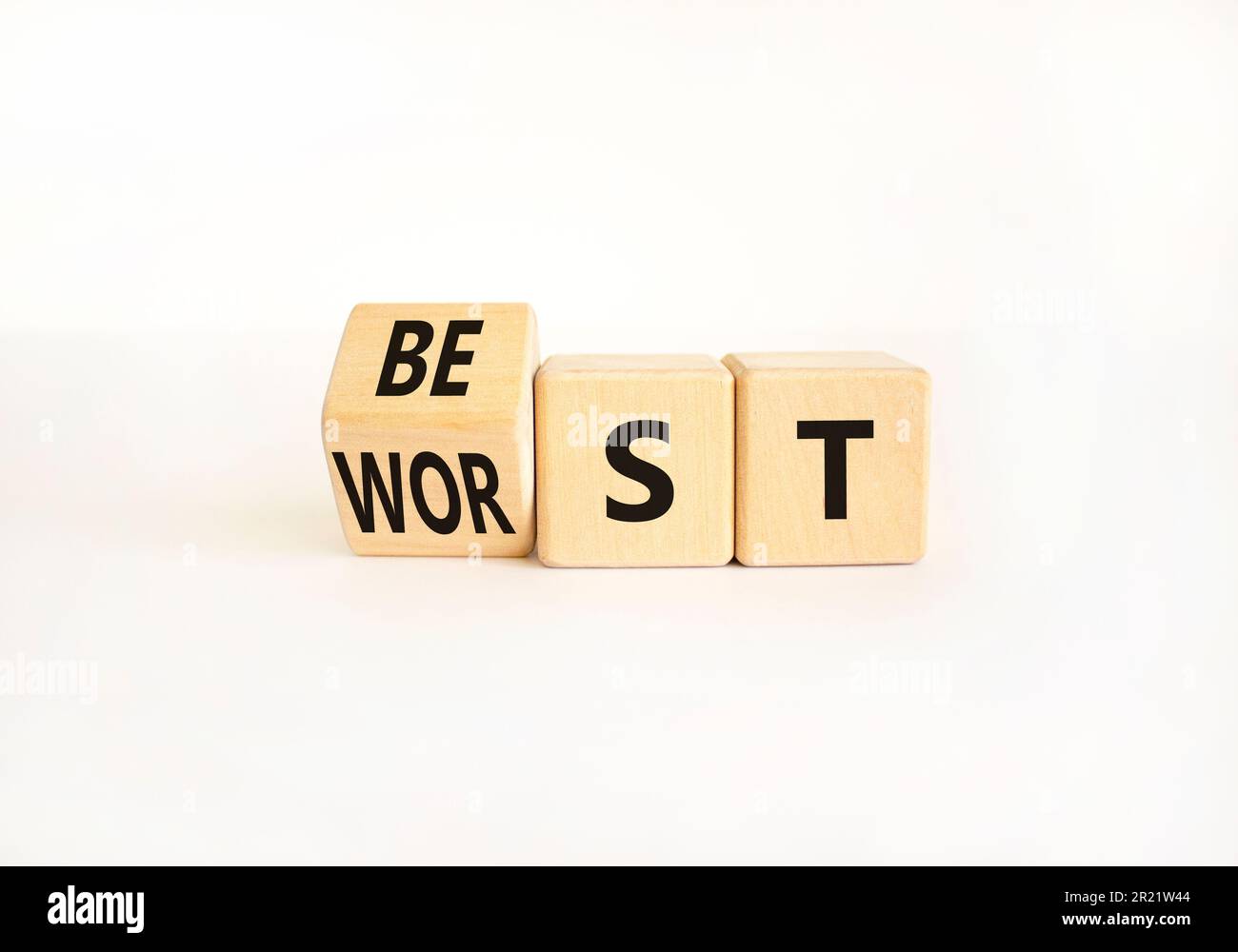 Best or worst symbol. Businessman turns wooden cubes and changes the ...