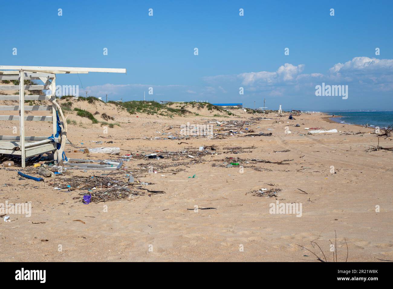 Sandy beach with garbage carried by the wave. Ocean pollution Stock ...