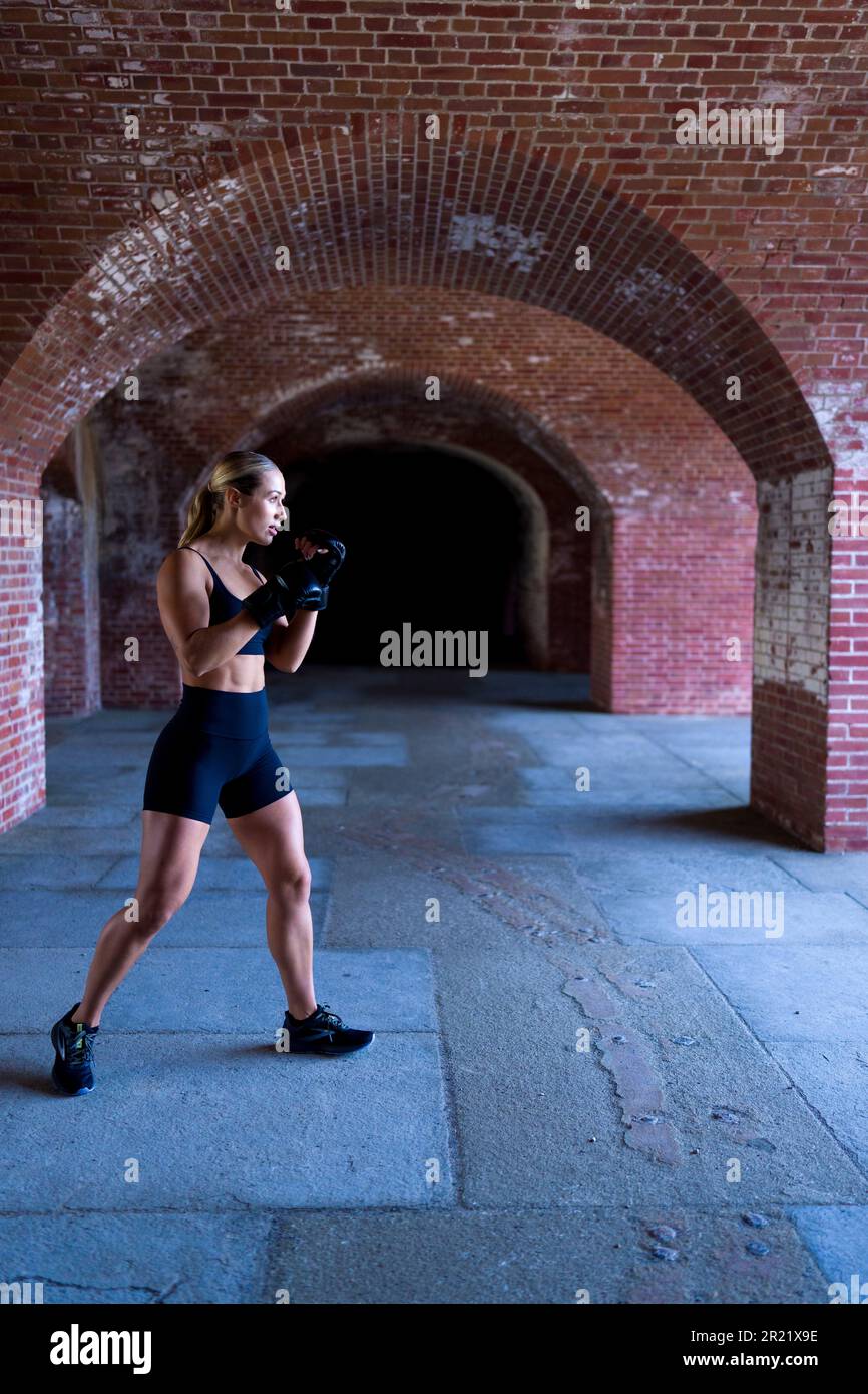 Beautiful Young Brawny Woman Shadow Boxing in an Old Brick Fort Stock ...
