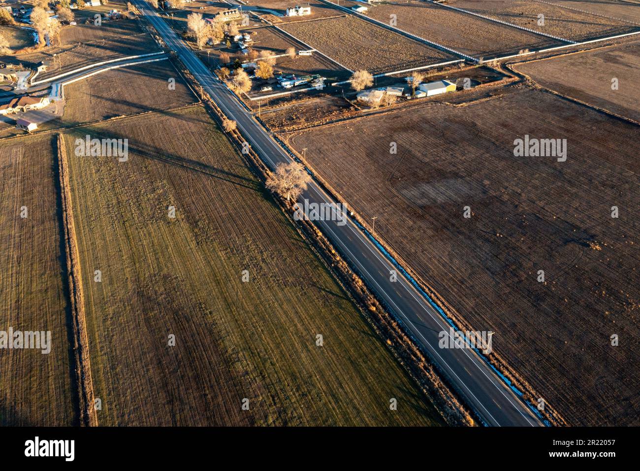 An overhead view of a paved roadway leading to multiple paths, the main ...