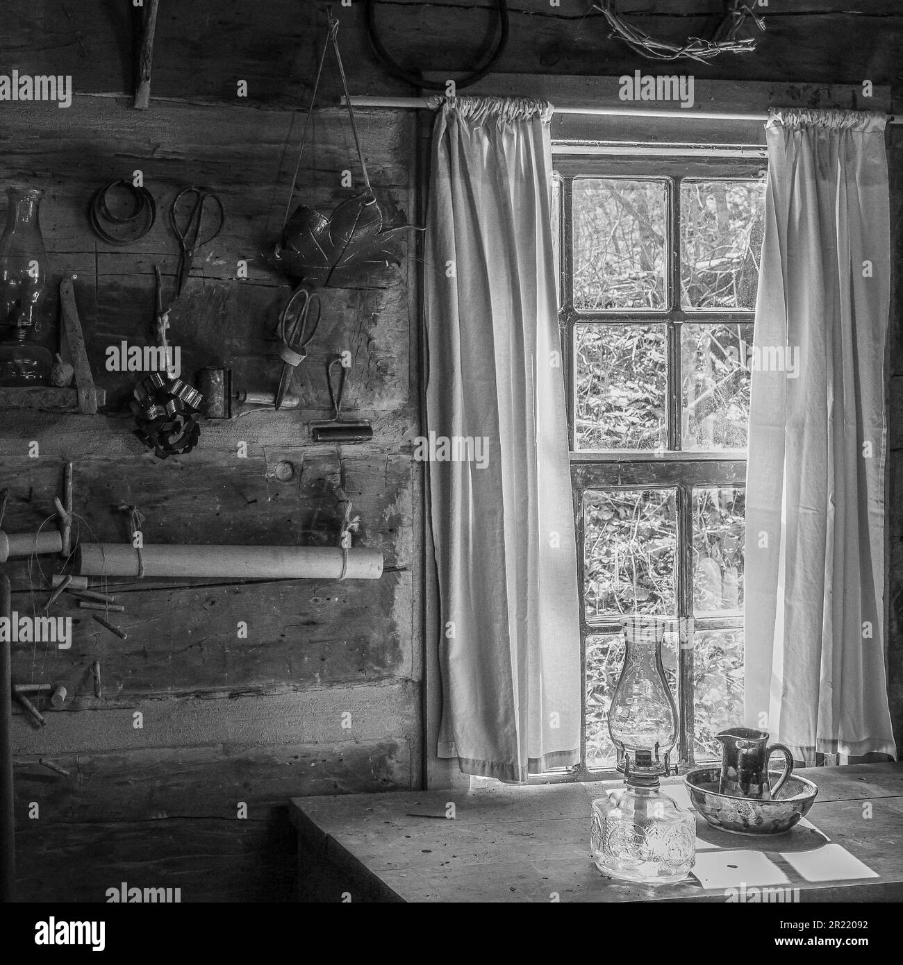 A grayscale shot of a cozy rustic kitchen interior of a cabin Stock ...