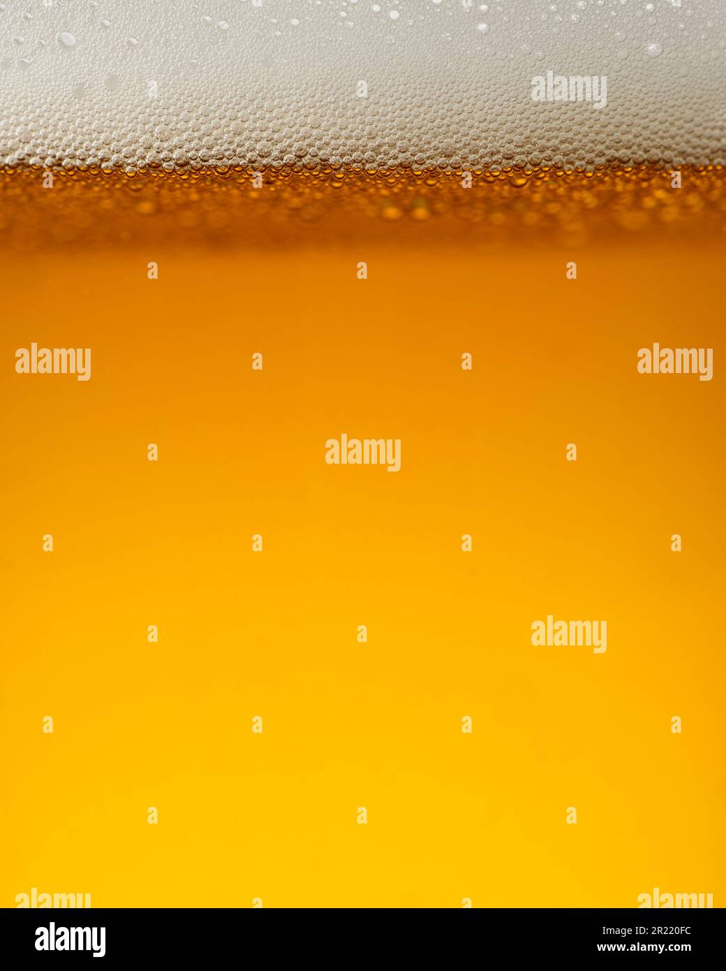 Close up background texture of lager beer with bubbles and froth Stock ...