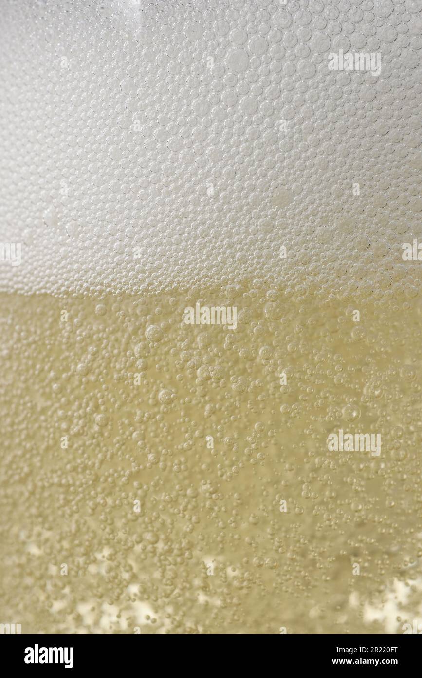 Close up background texture of sparkling wine champagne with bubbles ...
