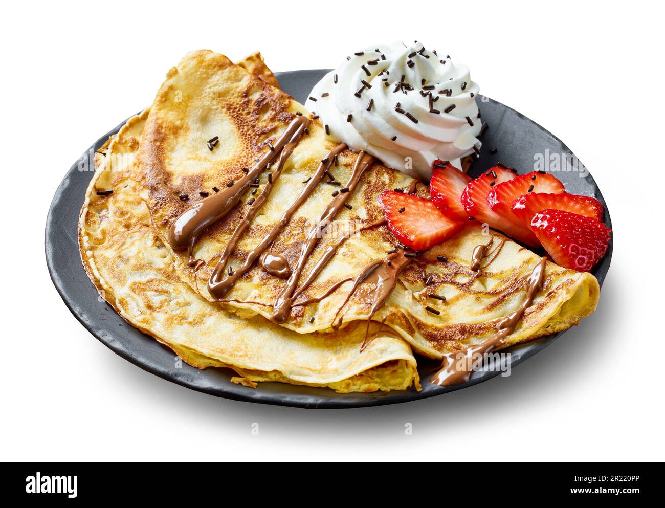 plate of freshly baked crepes with strawberries and cream isolated on ...