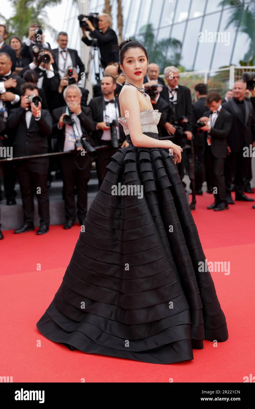 Guan Xiaotong poses for photographers upon arrival at the opening ...