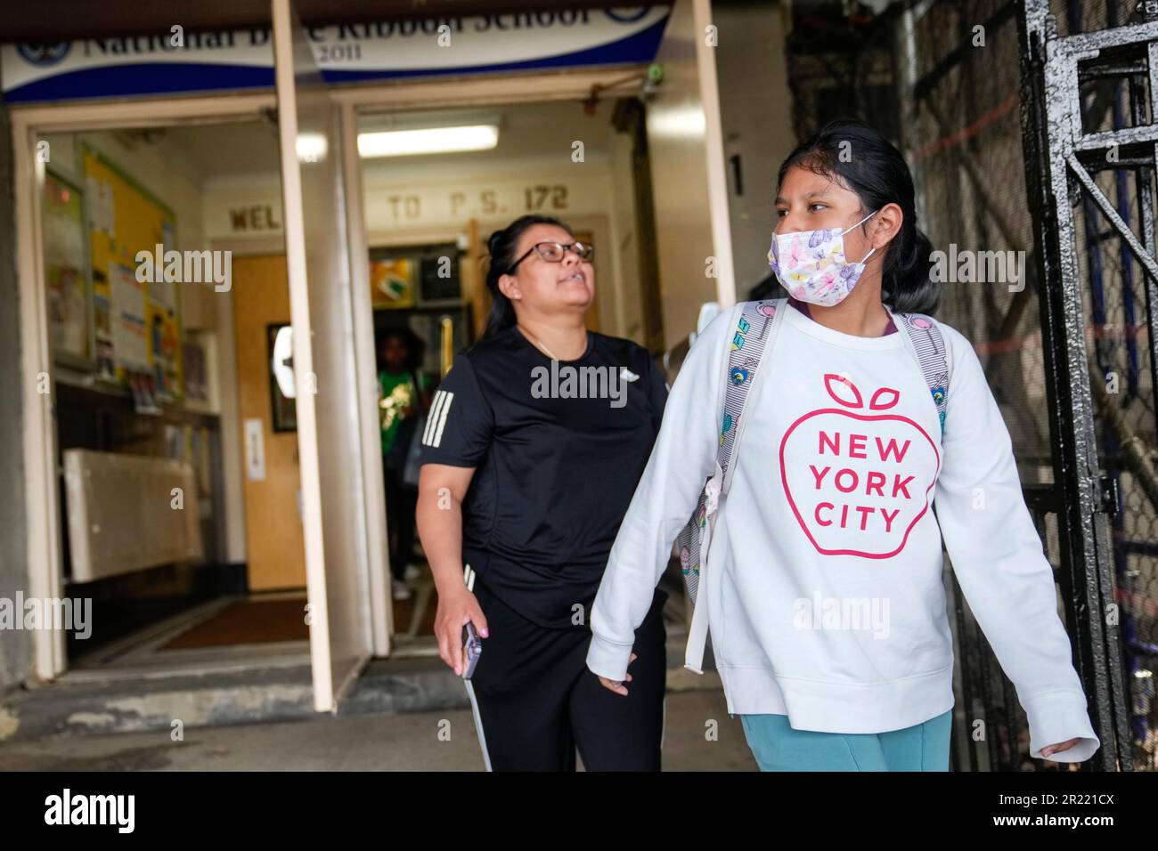 Students and their parents exit the main entrance of P.S. 172 after ...