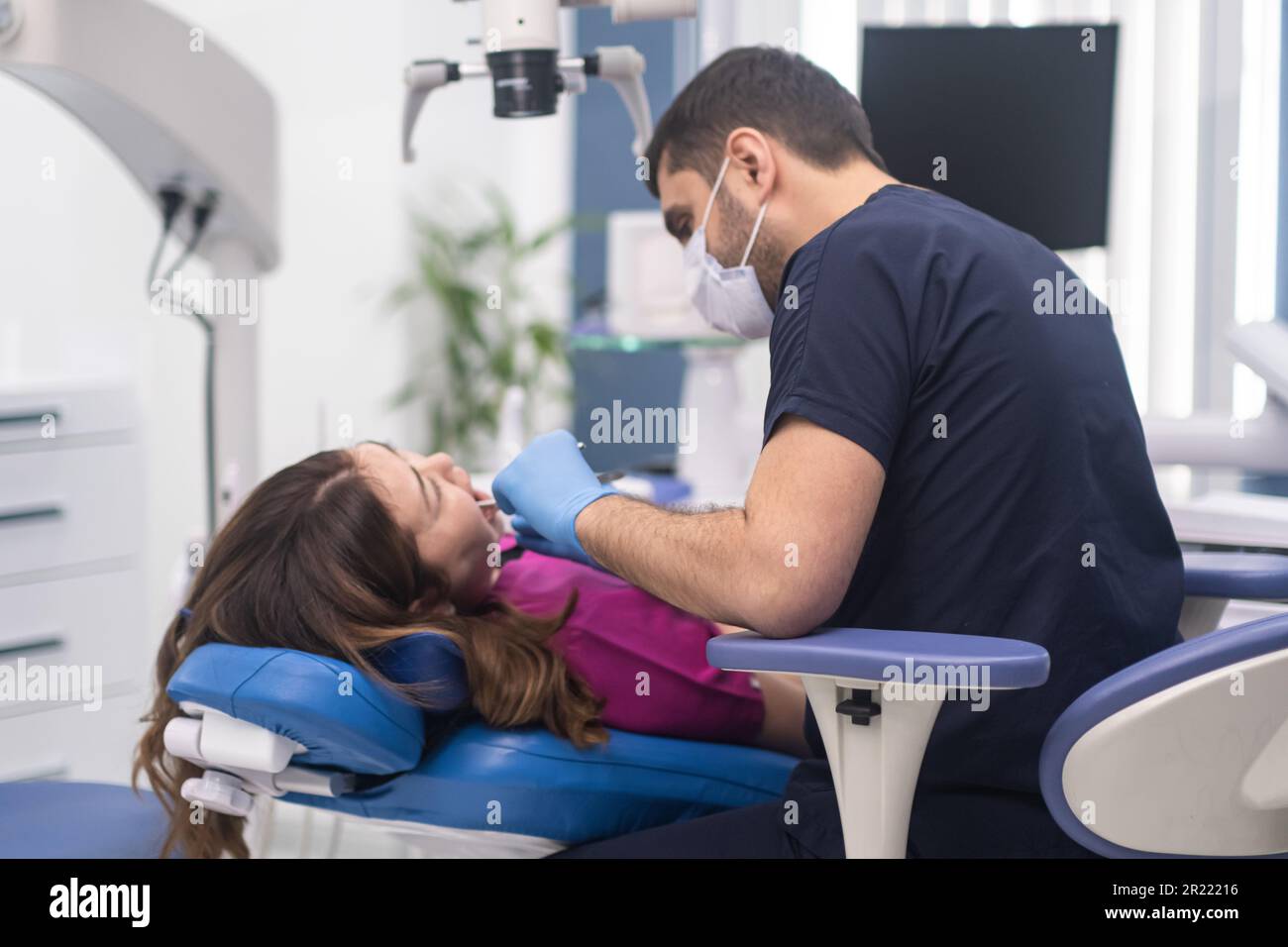 Dentistry clinic detailed checkup of female patient on couch focused ...