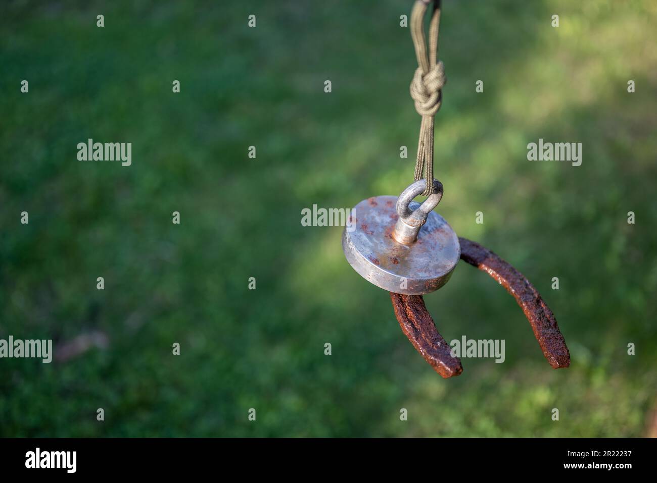 magnet fishing catch, an old rusty horseshoe Stock Photo - Alamy