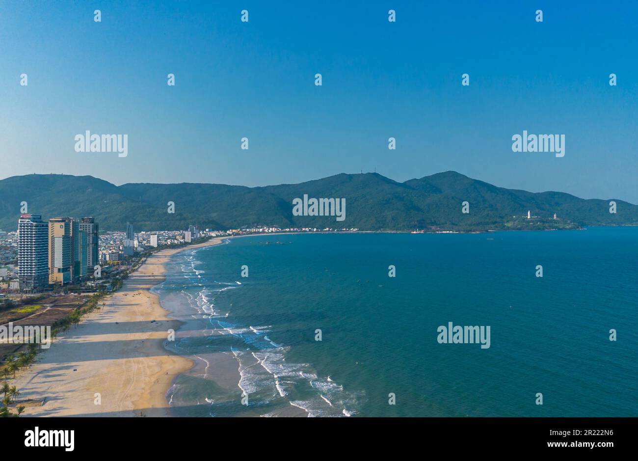Aerial sunset view of Da Nang coastline. My Khe beach seafront with ...