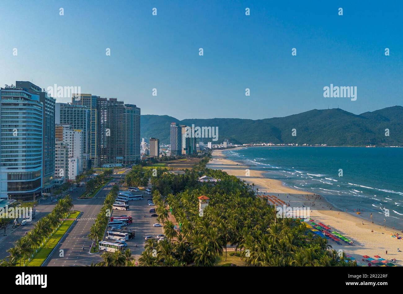 Aerial sunset view of Da Nang coastline. My Khe beach seafront with ...