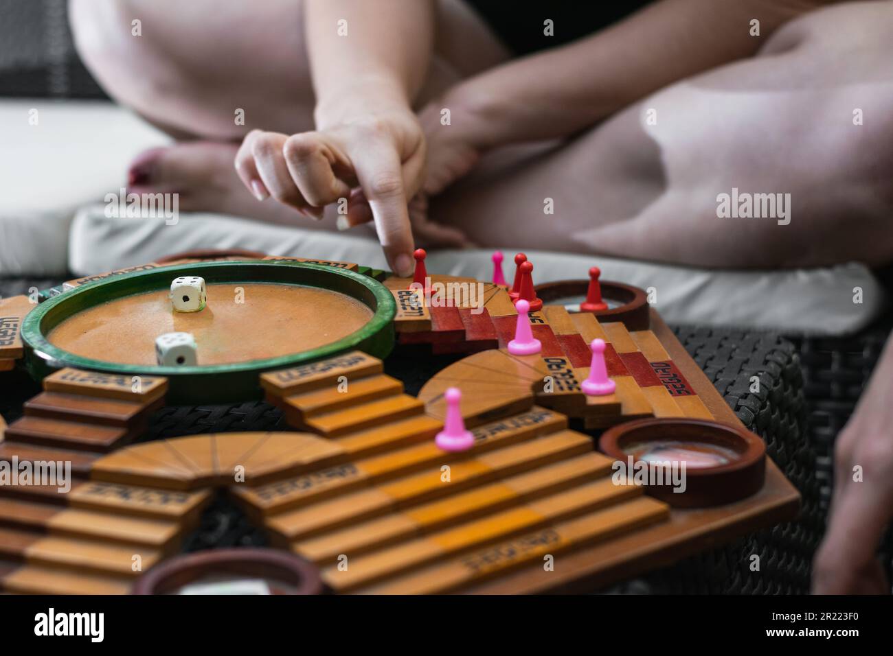 Close-up of a girl's hand counting the number of squares she needs to ...