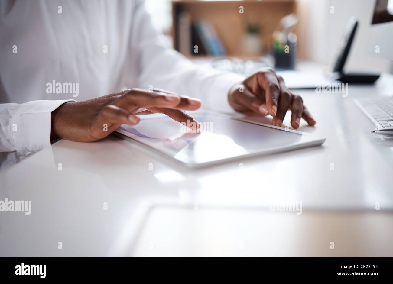 Scrolling my way to success. an unrecognisable businesswoman using a ...