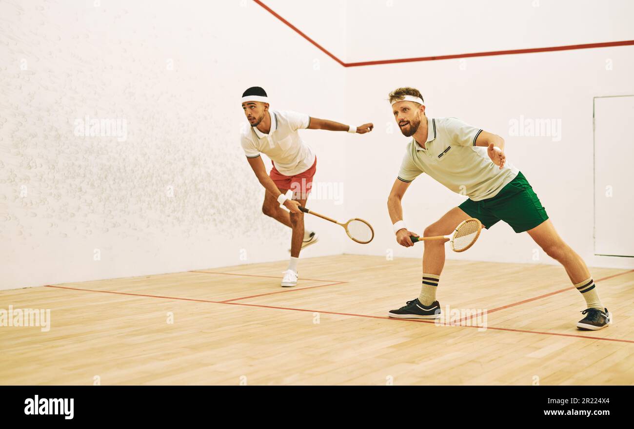One of the toughest sports there is. two young men playing a game of ...
