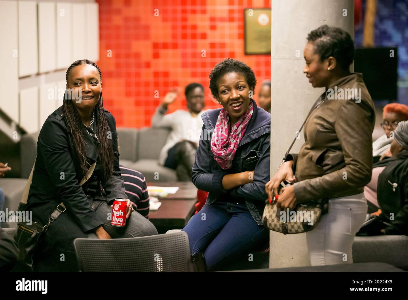Female friends interacting having hi-res stock photography and images ...