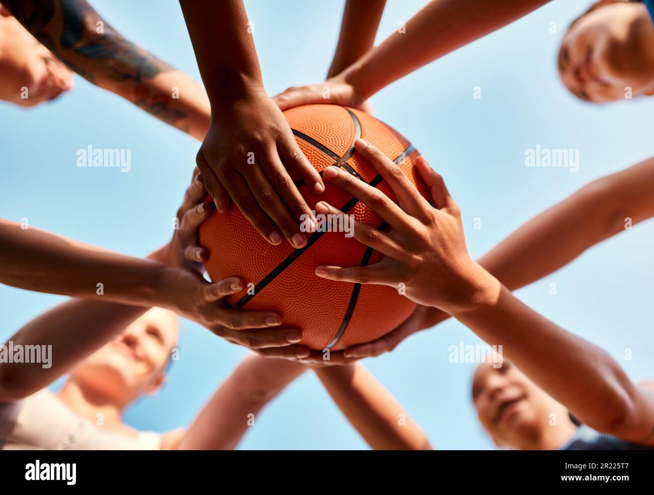 This is what holds us together. Low angle shot of a diverse group of ...