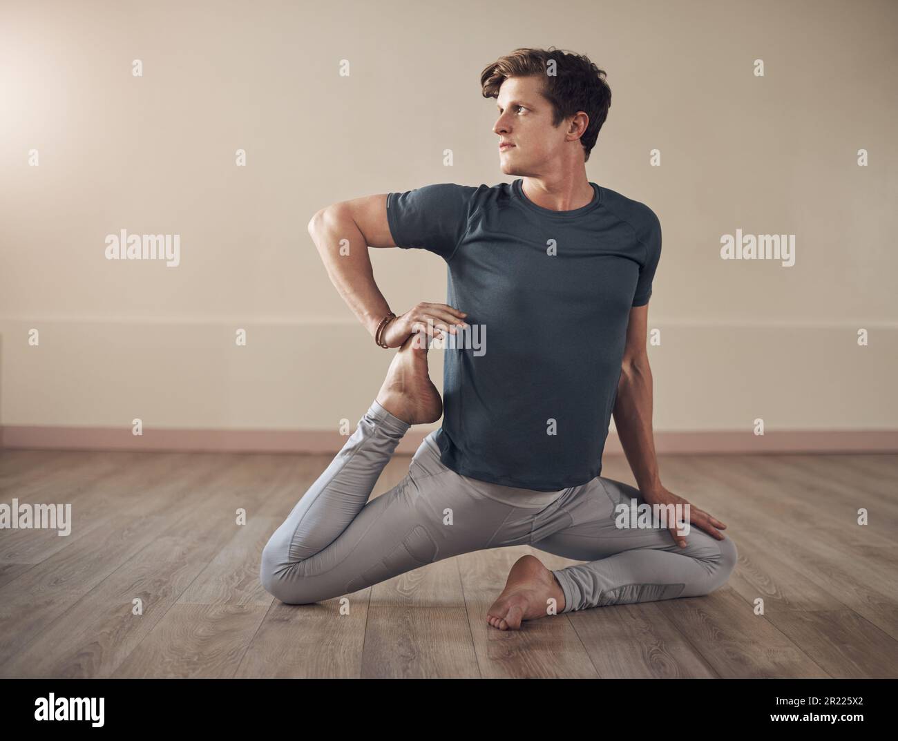 Log out, shut down and do yoga. Full length shot of a handsome young ...