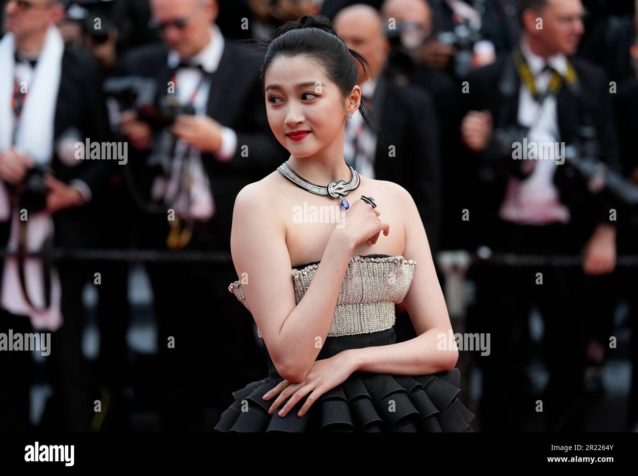 Guan Xiaotong poses for photographers upon arrival at the opening ...