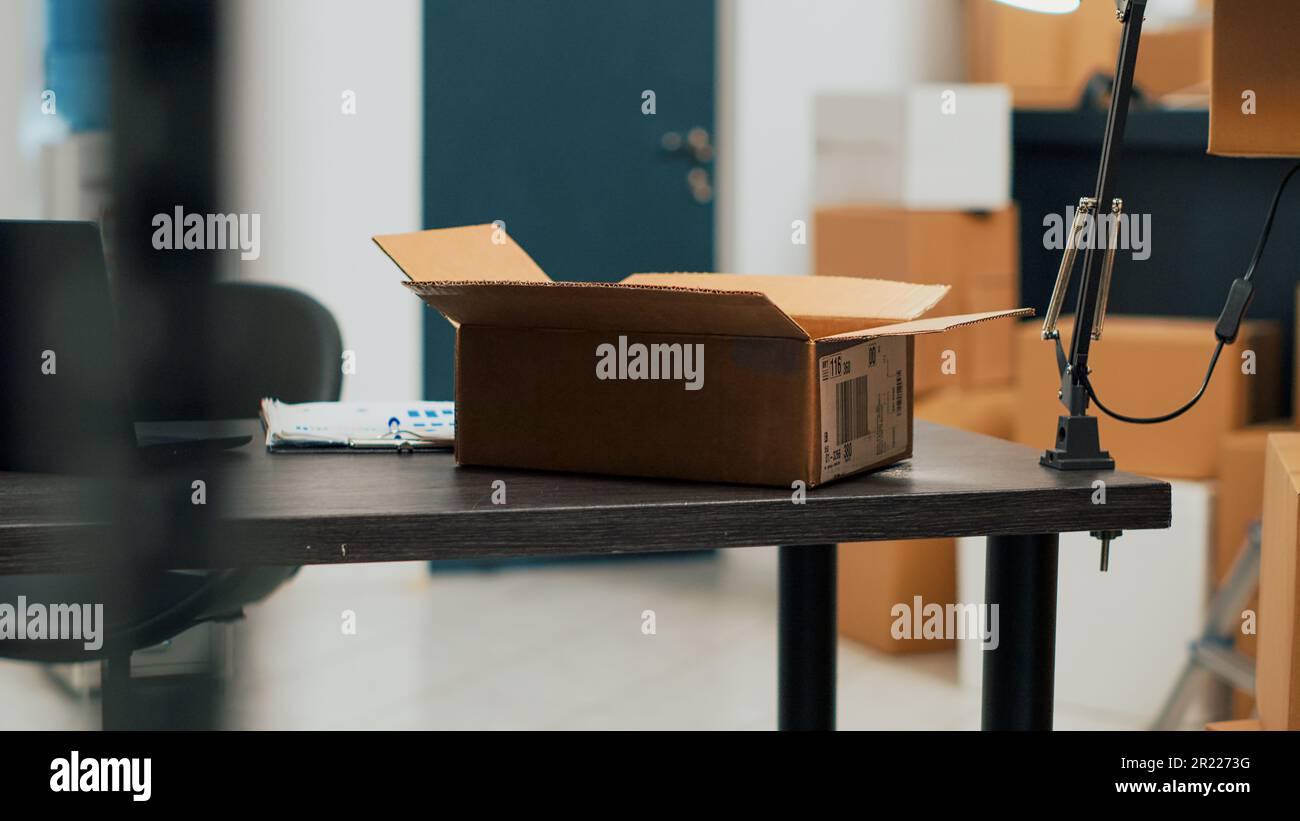 Empty warehouse office space filled with cardboard boxes and products ...