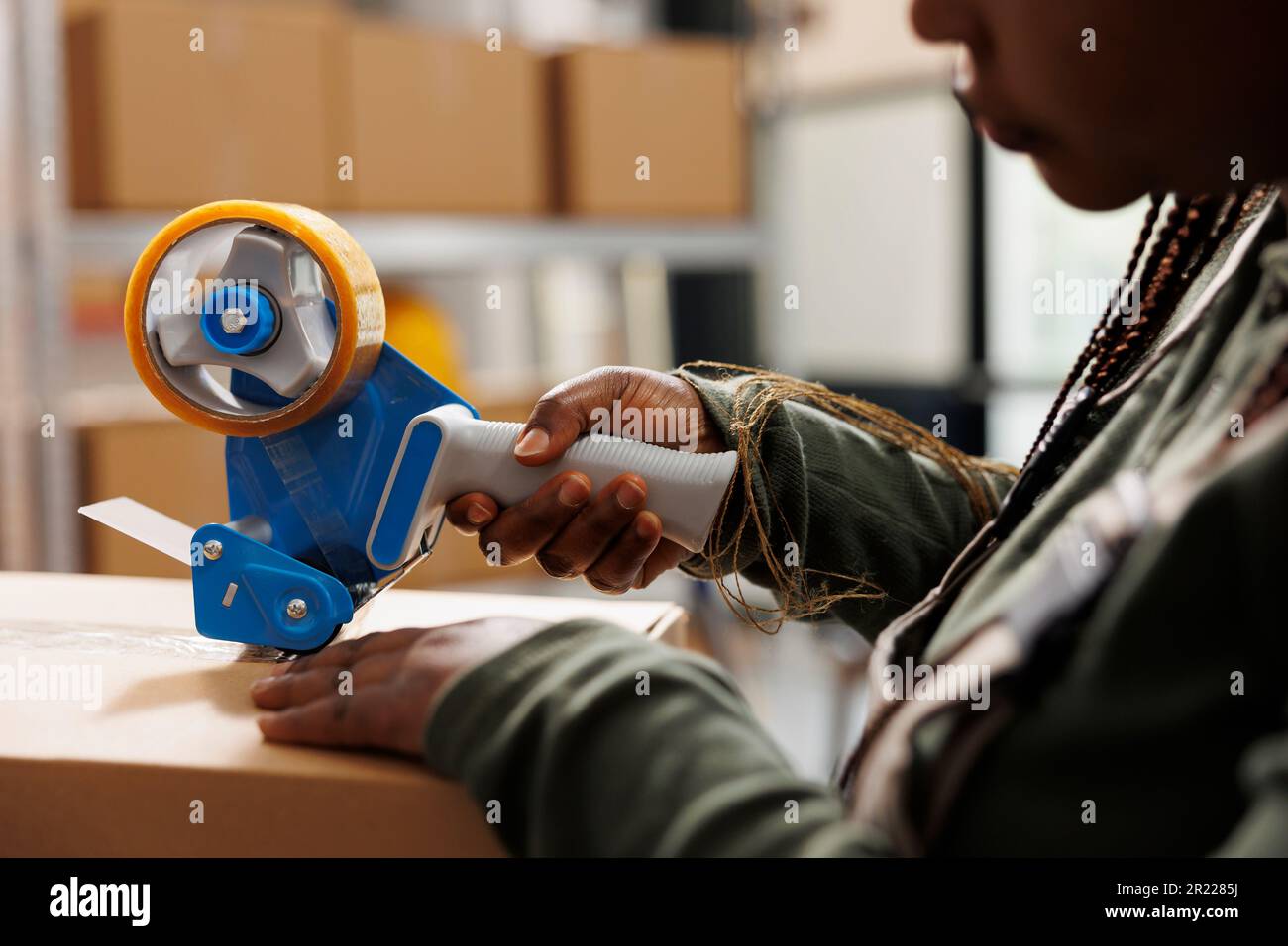 Worker putting tape on hi-res stock photography and images - Alamy