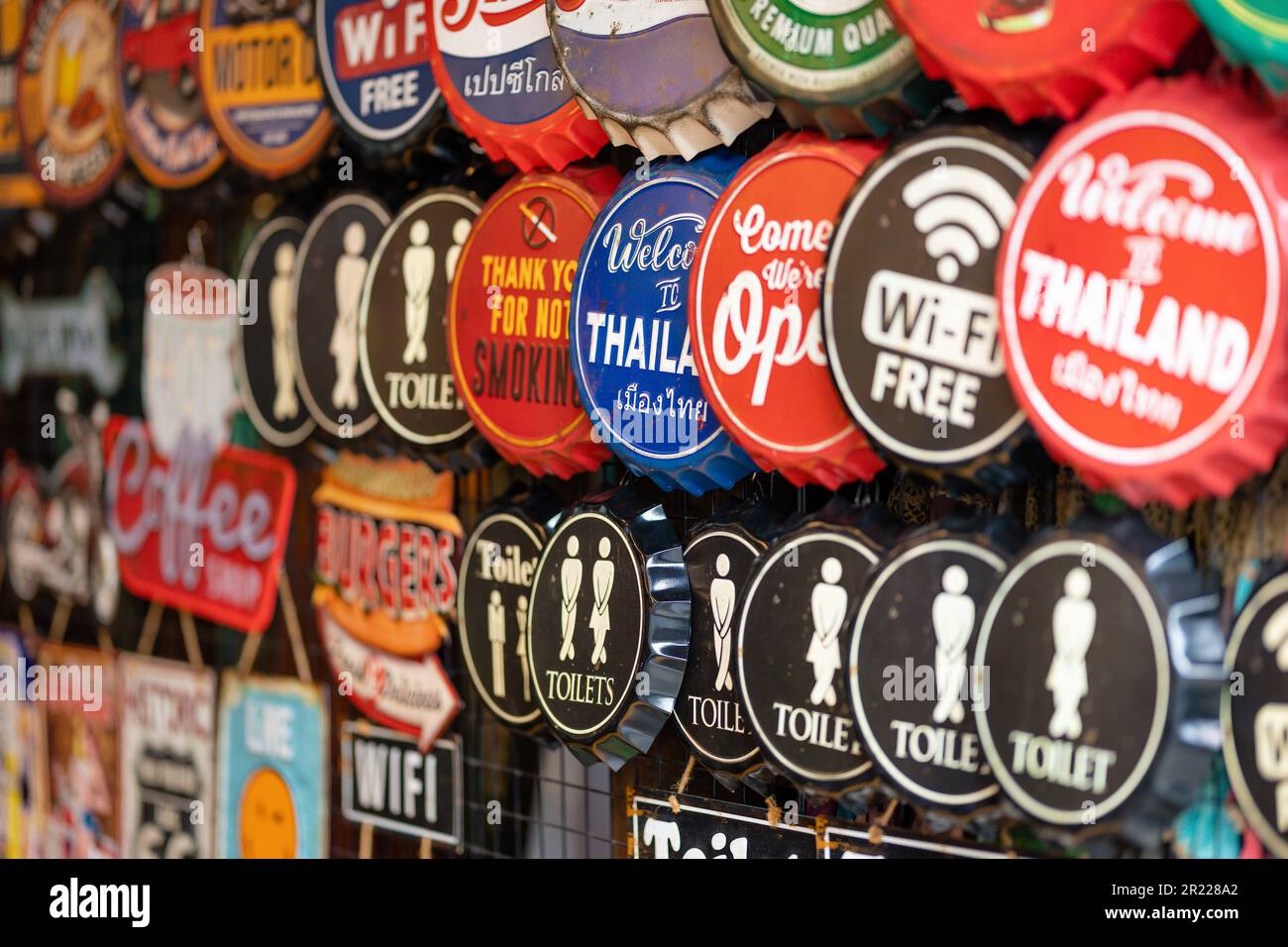 A vibrant, eye-catching wall featuring an eclectic mix of signs and ...