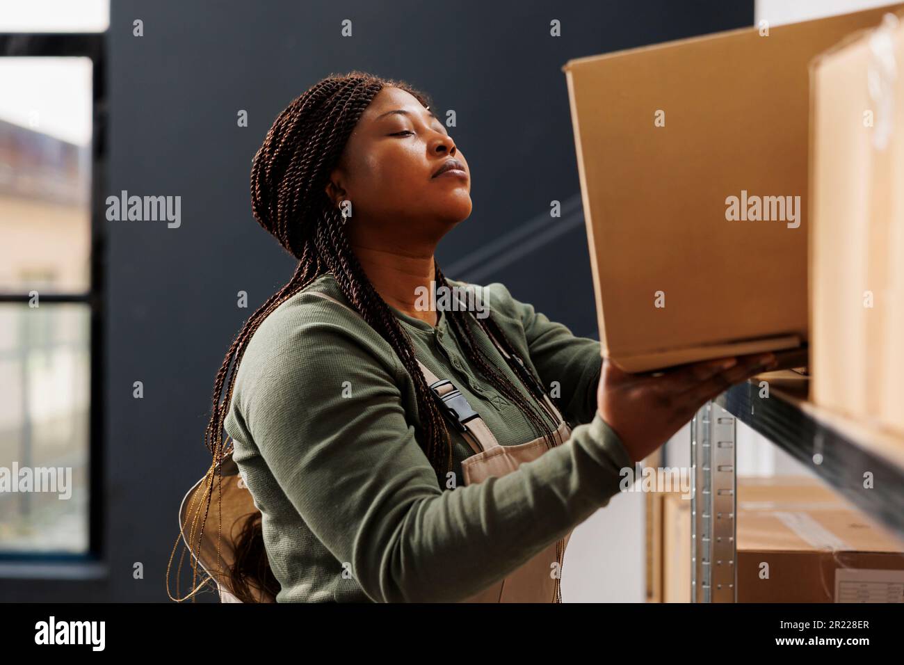 Factory worker putting packages boxes hi-res stock photography and ...