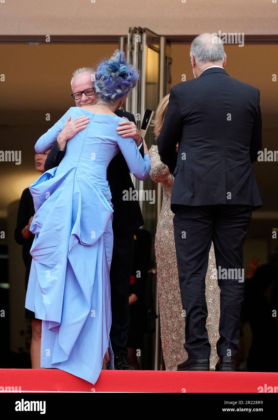 Festival director Thierry Fremaux, left, shares an embrace with Helen ...