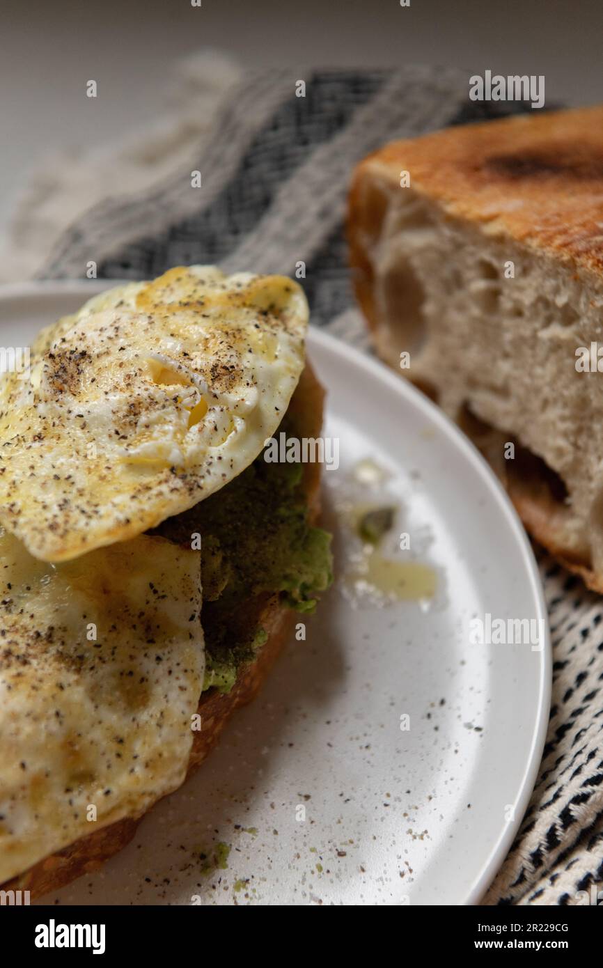 Egg avocado toast with beautiful artisan bread Stock Photo - Alamy