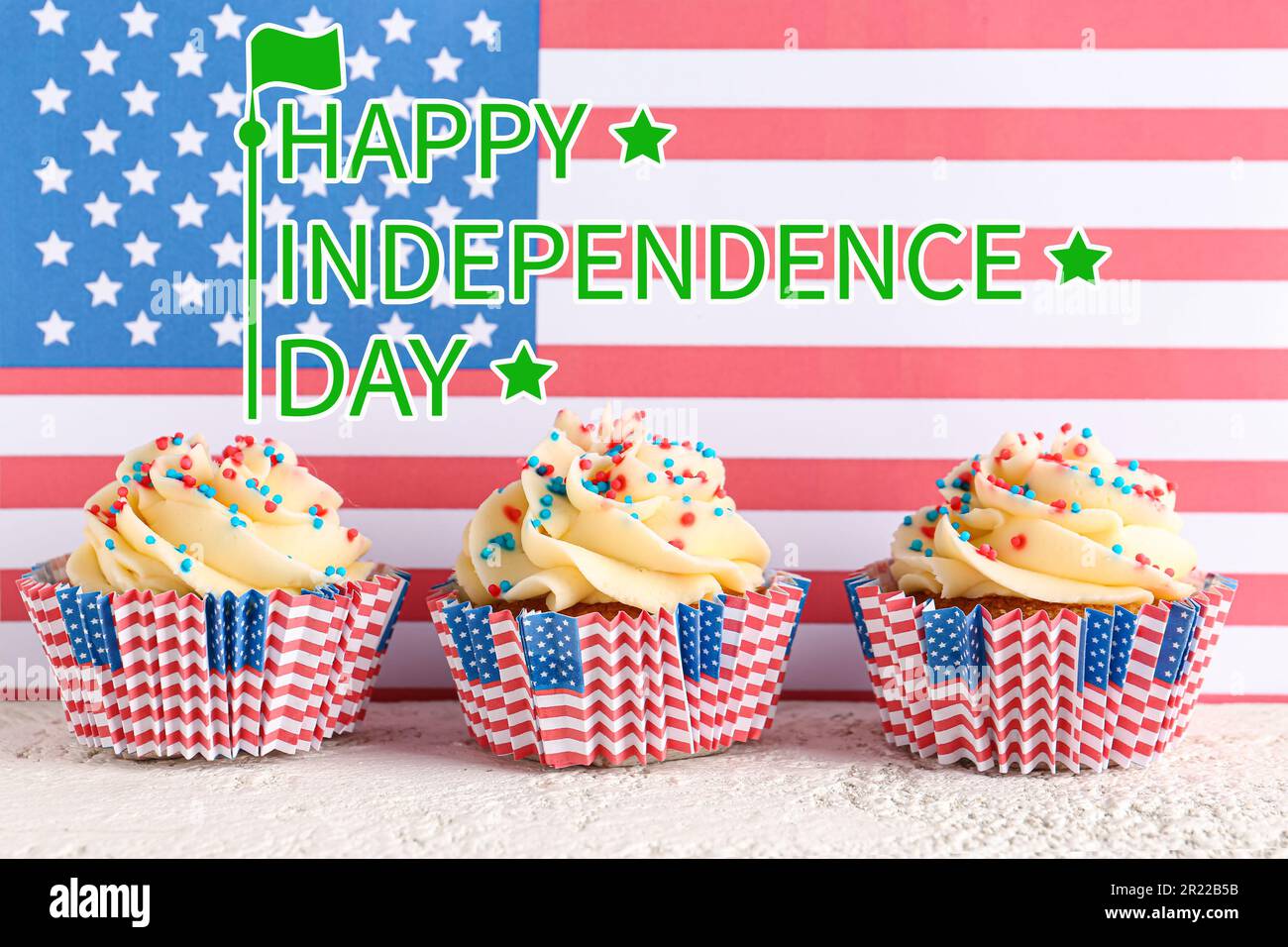 Tasty patriotic cupcakes against USA flag. Happy Independence Day Stock ...