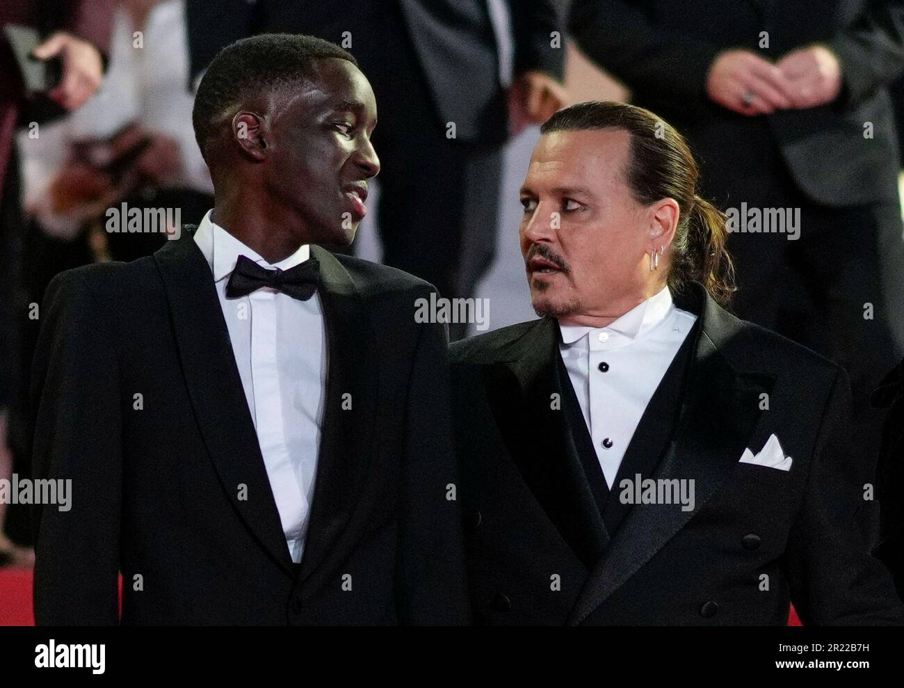 Djibril Djimo, left, and Johnny Depp pose for photographers upon ...