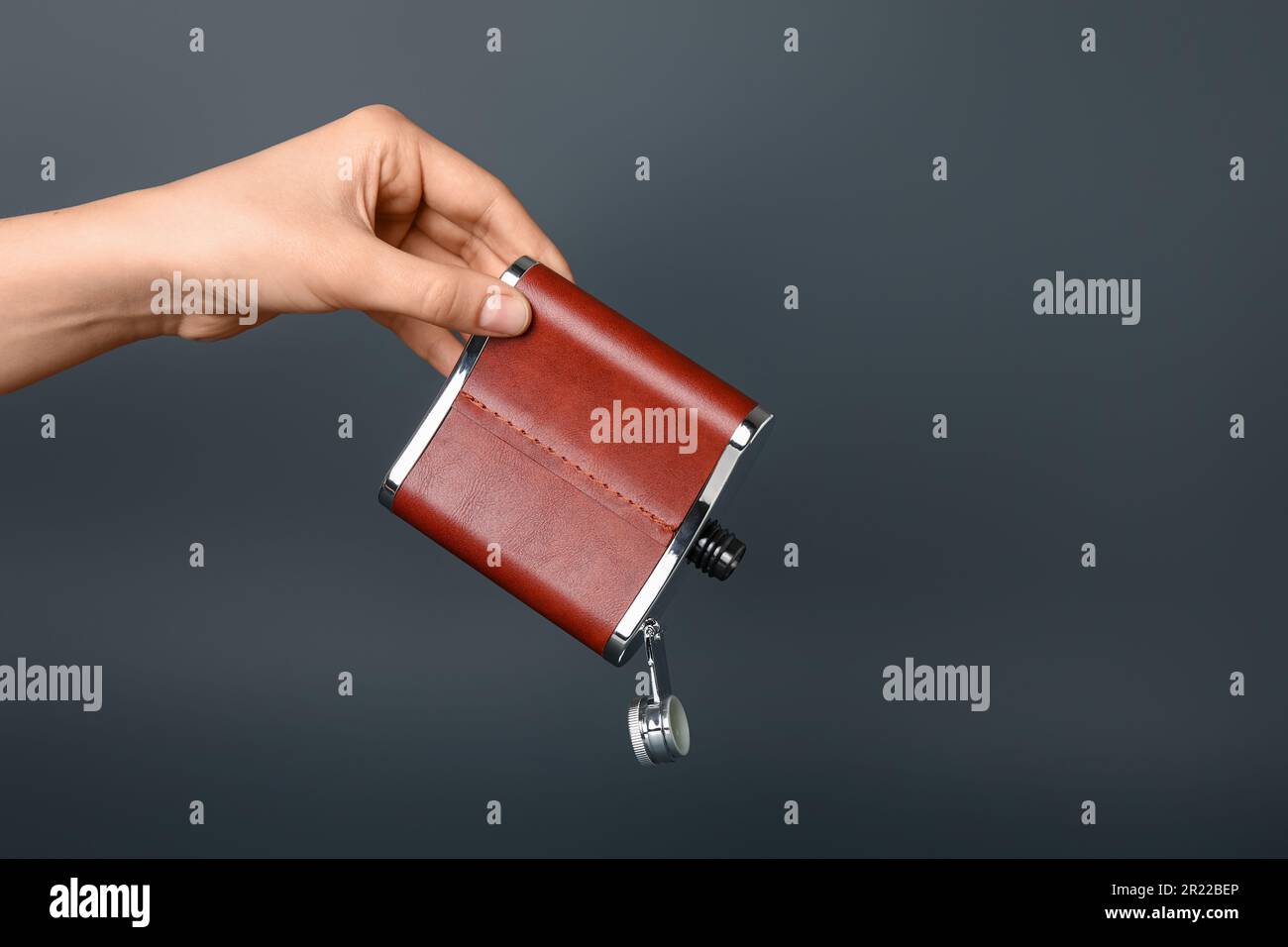Male hand holding hip flask hi-res stock photography and images - Alamy